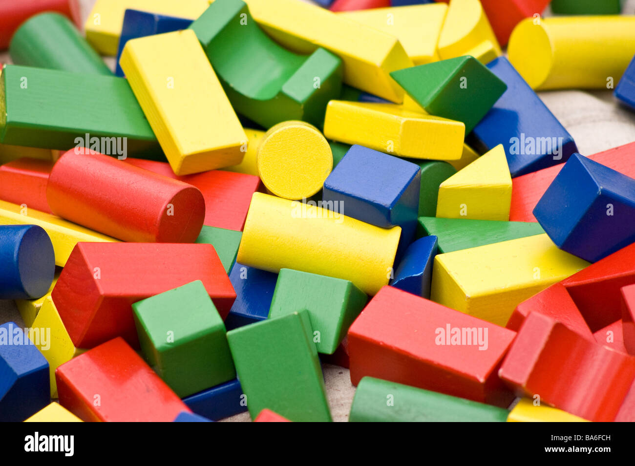 A bunch of colorful, wooden blocks on the floor of a playroom Stock ...