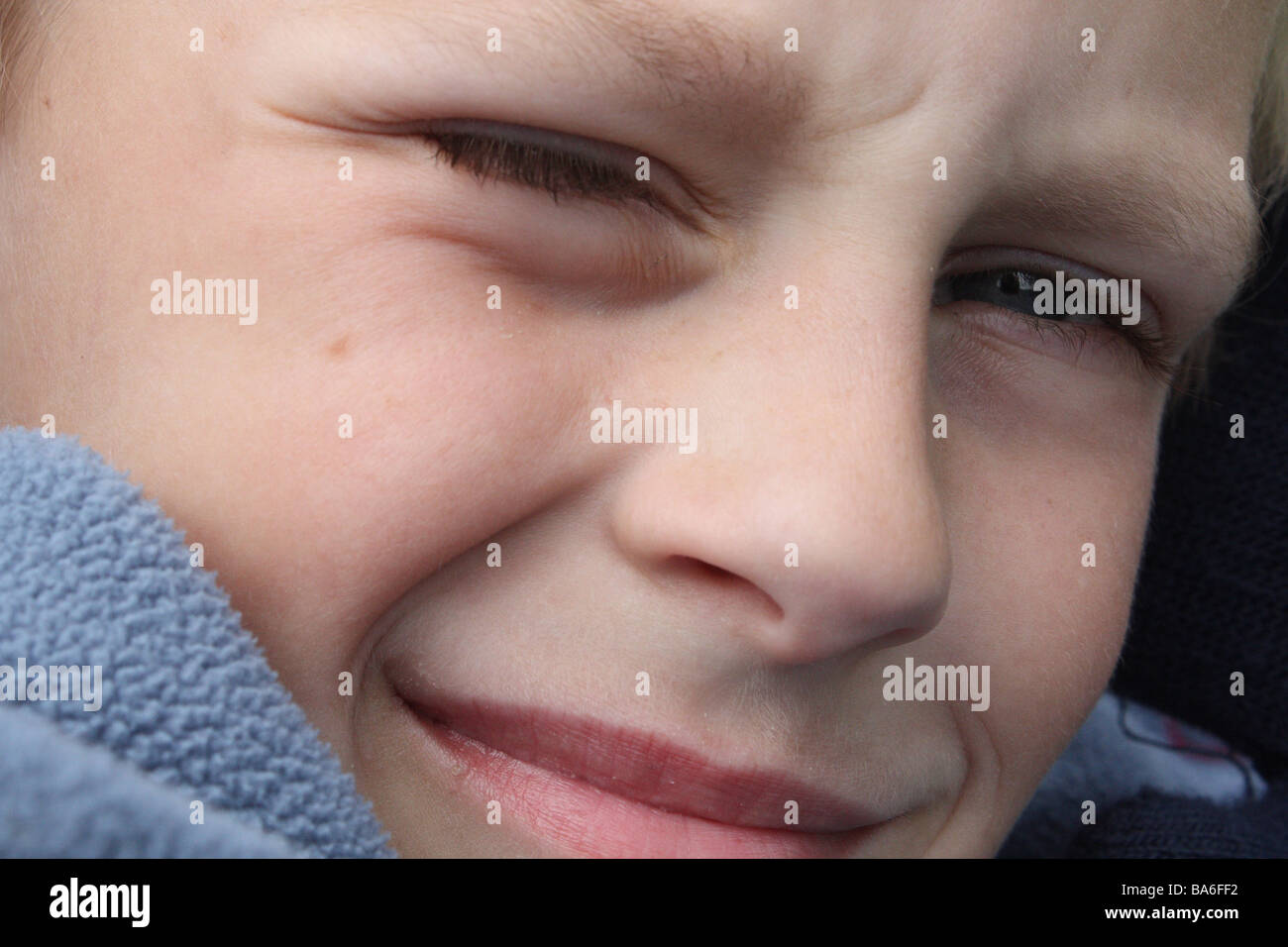 Boys Face Squinting in the sun Stock Photo - Alamy