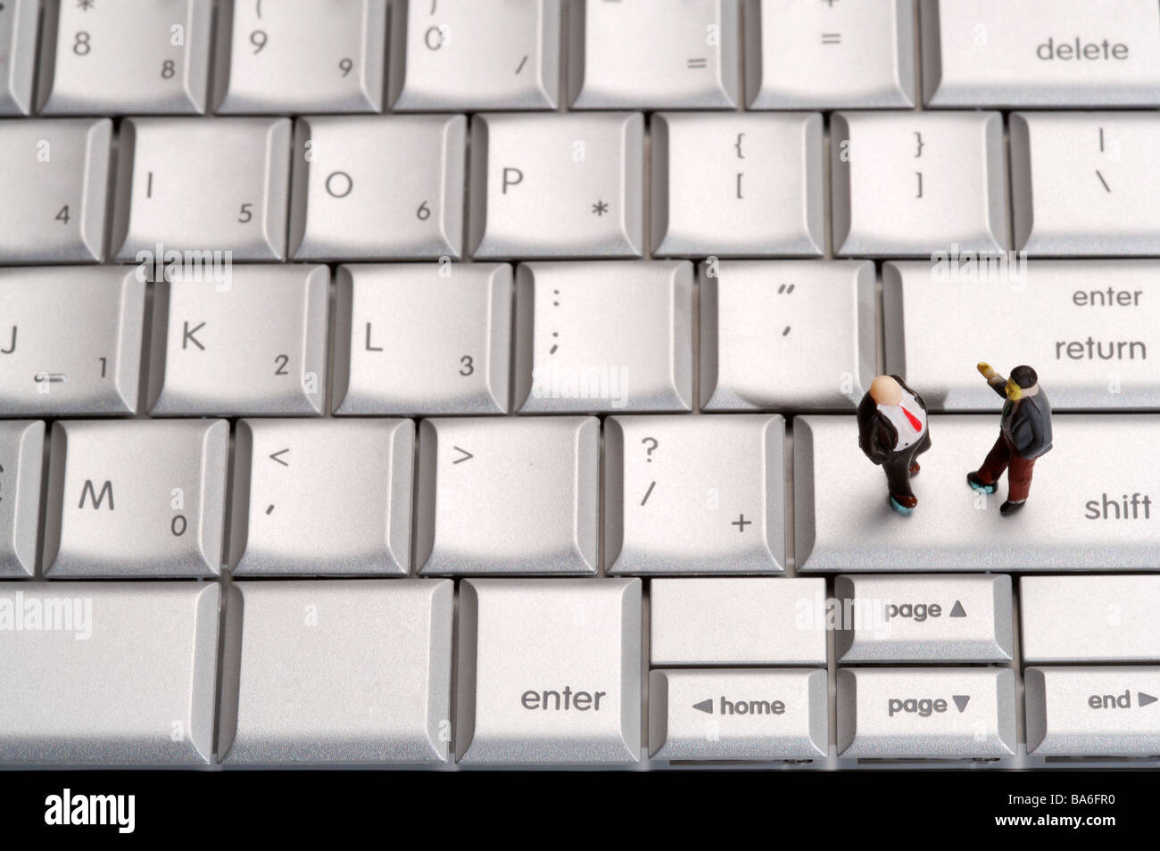 Two unreal persons on keyboard Stock Photo - Alamy