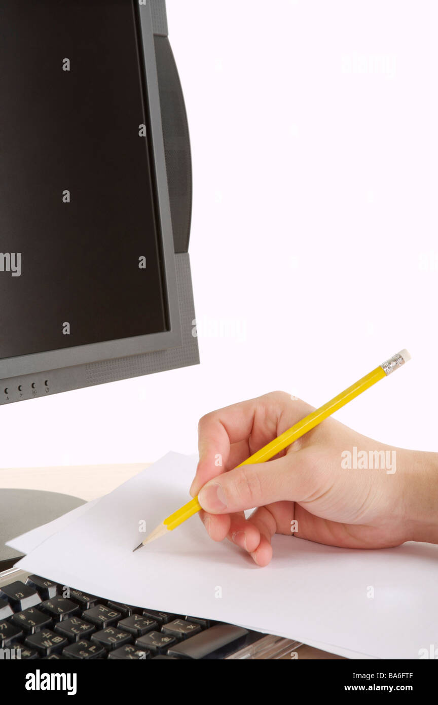 Businessman writing in front of computer Stock Photo - Alamy