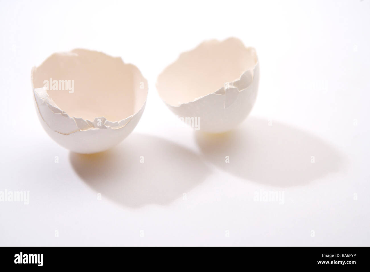 Close up of empty egg shell against white background Stock Photo - Alamy