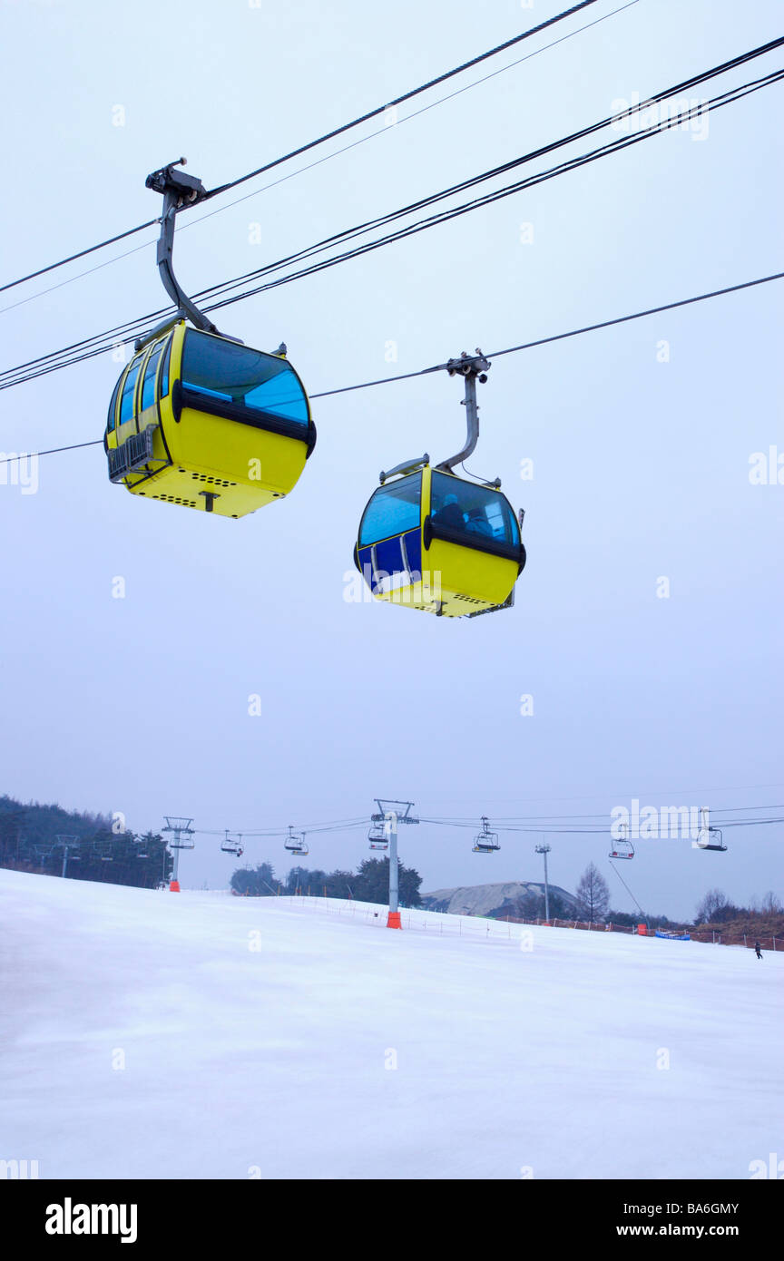 Two cable cars hanging in the mid air Stock Photo - Alamy