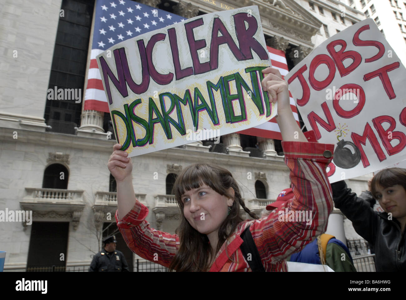 Teens carry signs calling for nuclear disarmament during a peace march ...