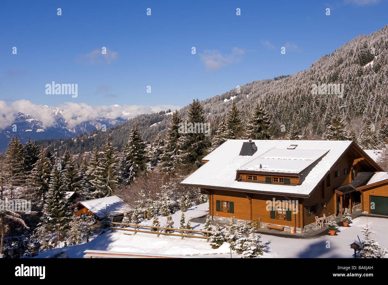Switzerland, Canton of Vaud, Villars sur Ollon, snow-covered chalet ...