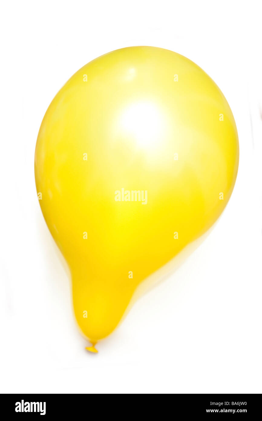 Yellow balloon isolated on a white studio background Stock Photo - Alamy