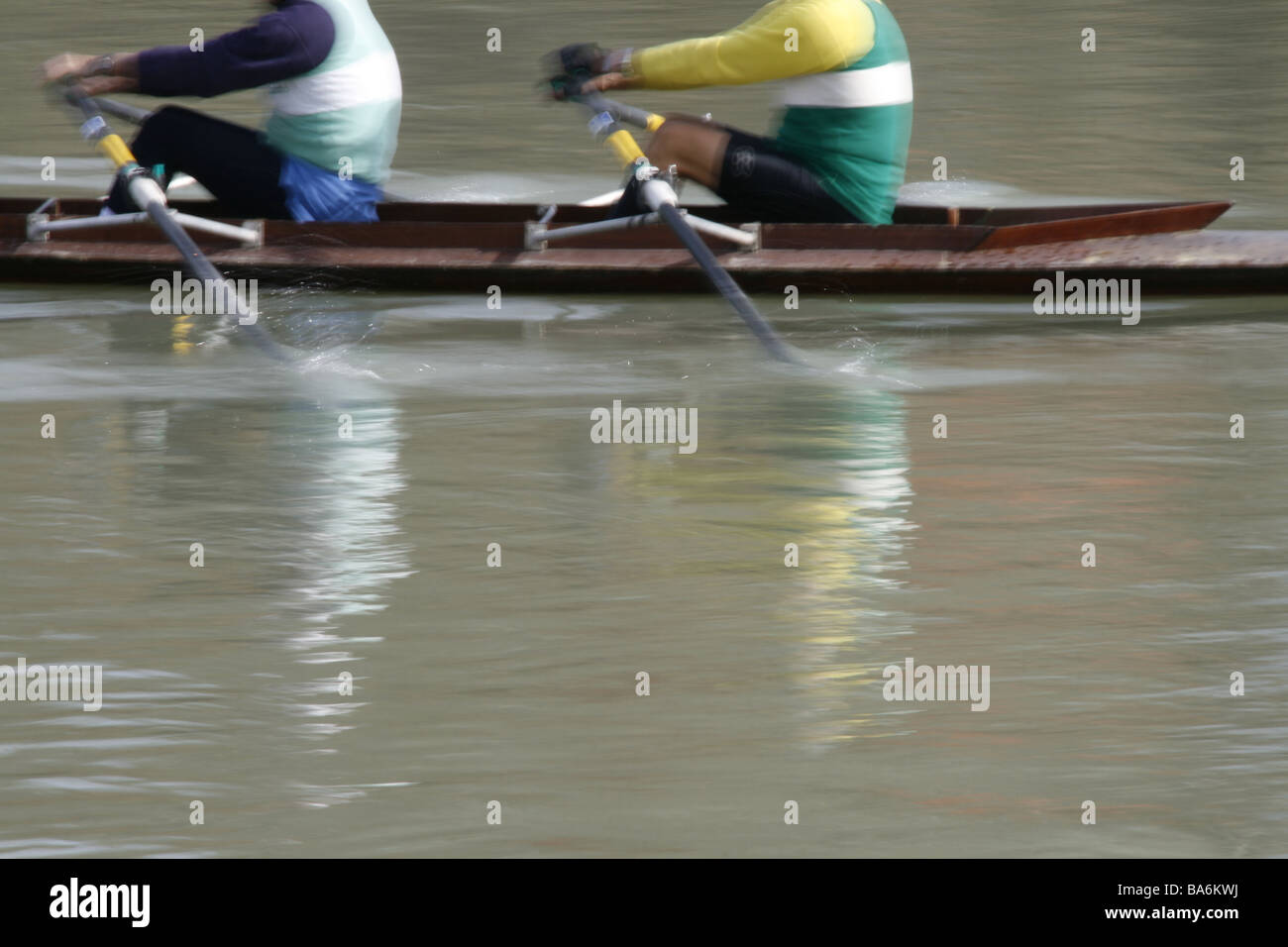 two rowers in boat on river in sun Stock Photo - Alamy