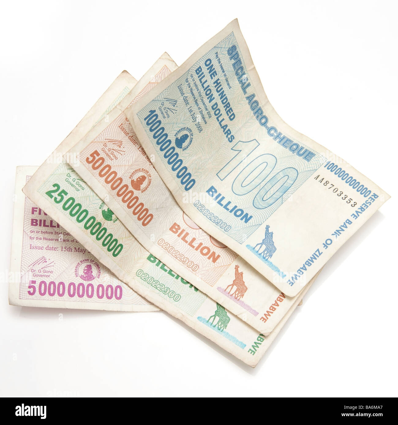 Billions of Zimbabwean dollar notes isolated on a white studio ...