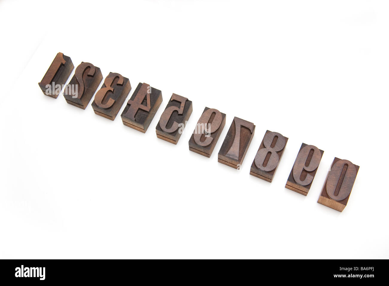 Wooden letterpress printing blocks isolated on a white studio ...
