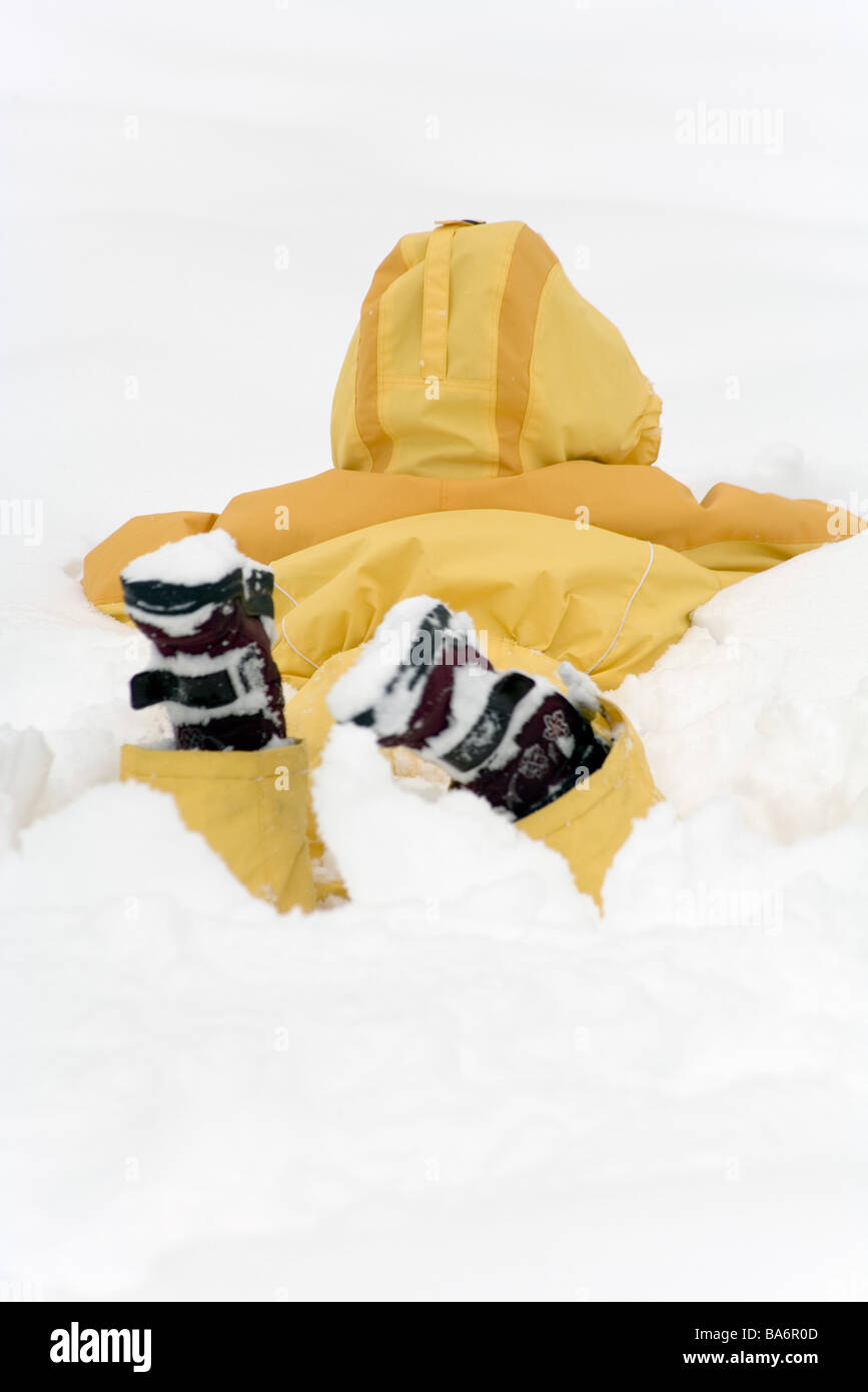 Child ski suit yellow snow-pile lies back-opinion snow-suit winter ...