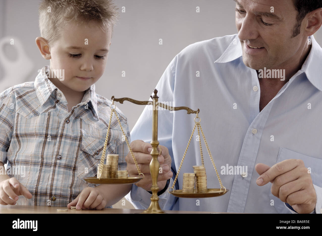 Scales Money People High Resolution Stock Photography and Images - Alamy