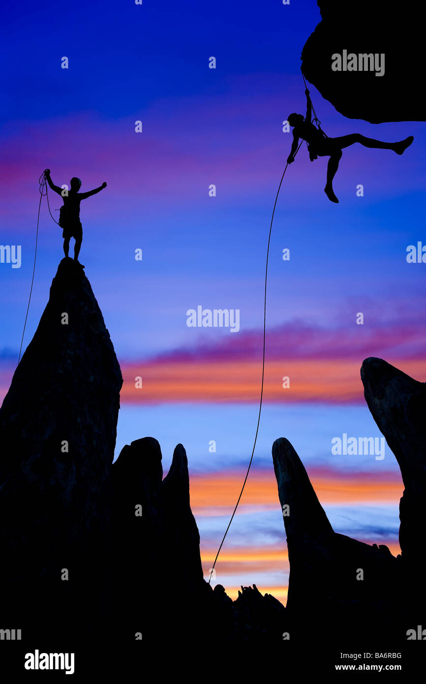 Team of rock climbers on the summit Stock Photo - Alamy