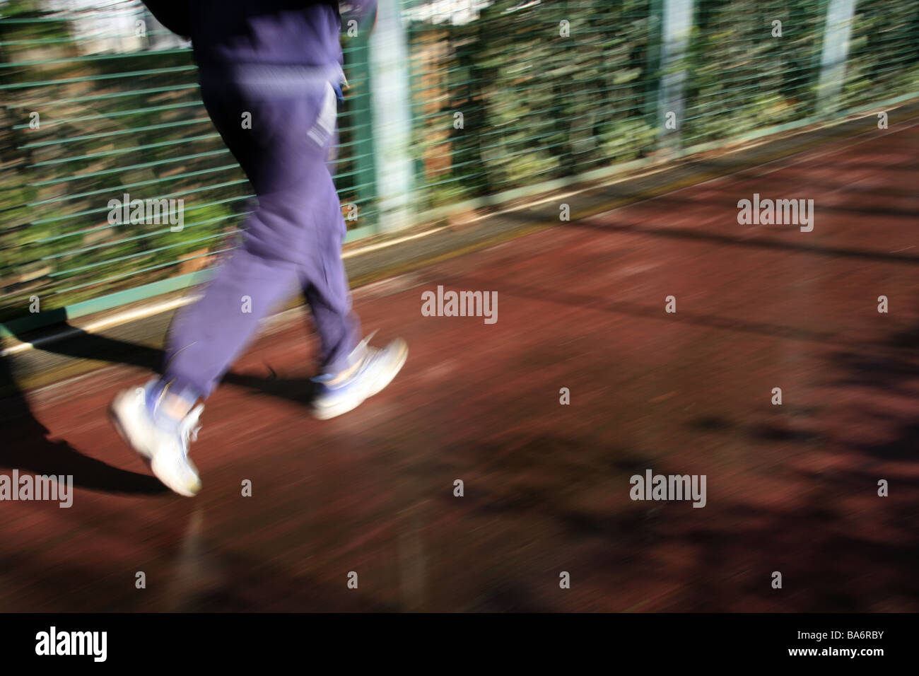 Lonely runner on road hi-res stock photography and images - Alamy