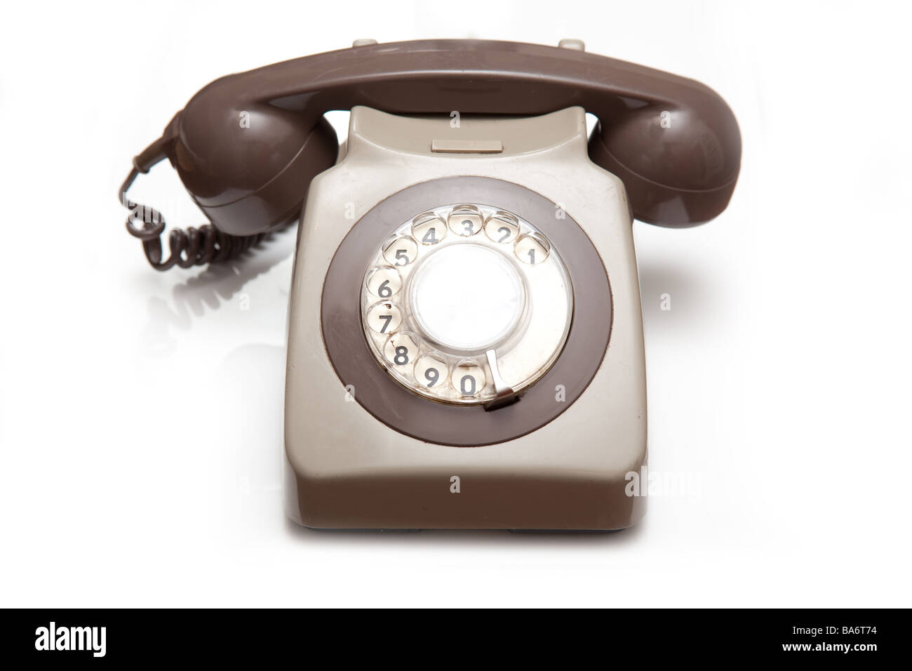 Traditional GPO rotary dial telephone isolated on a white studio ...