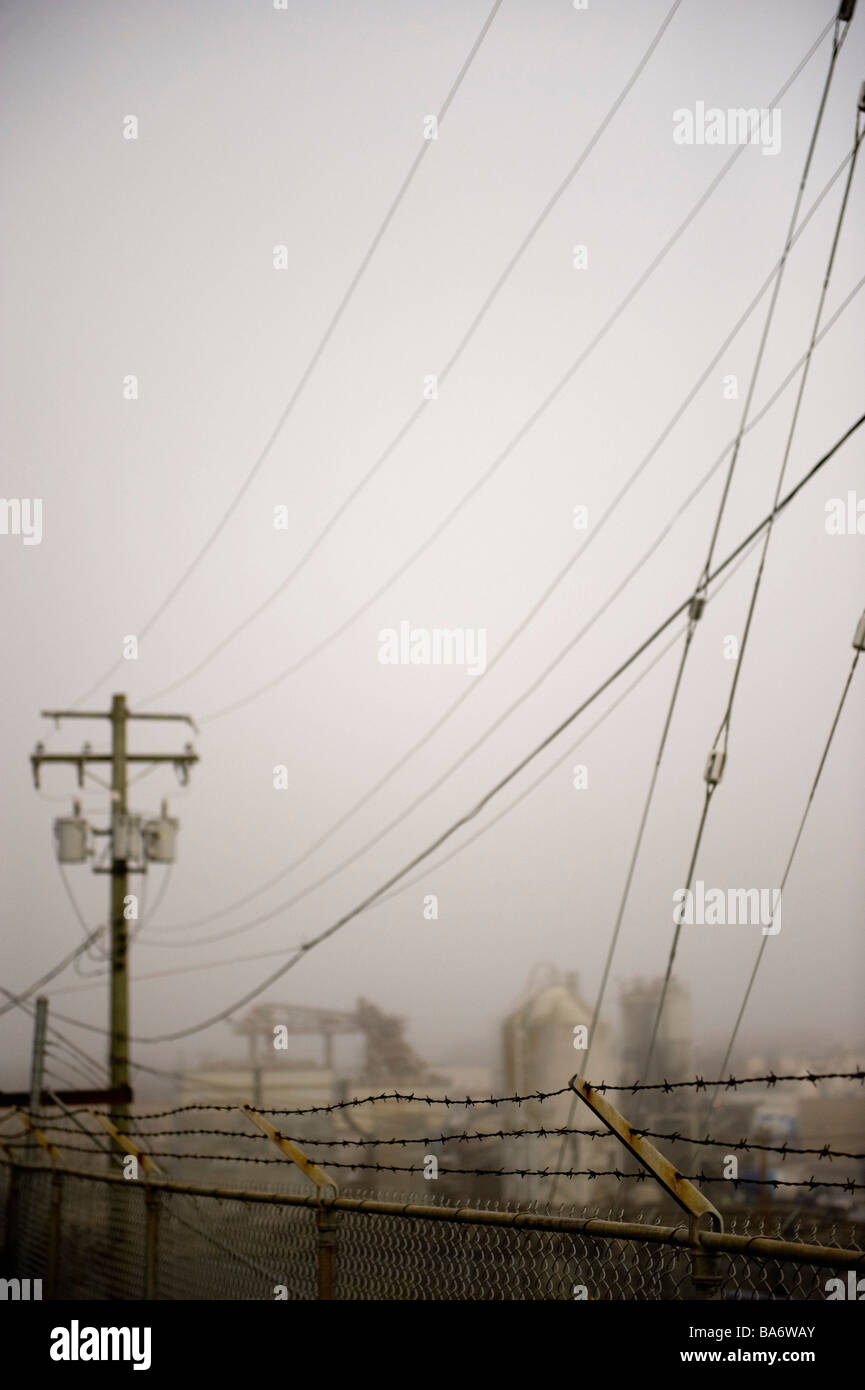 Power station surrounded by barbed wire fences Stock Photo - Alamy