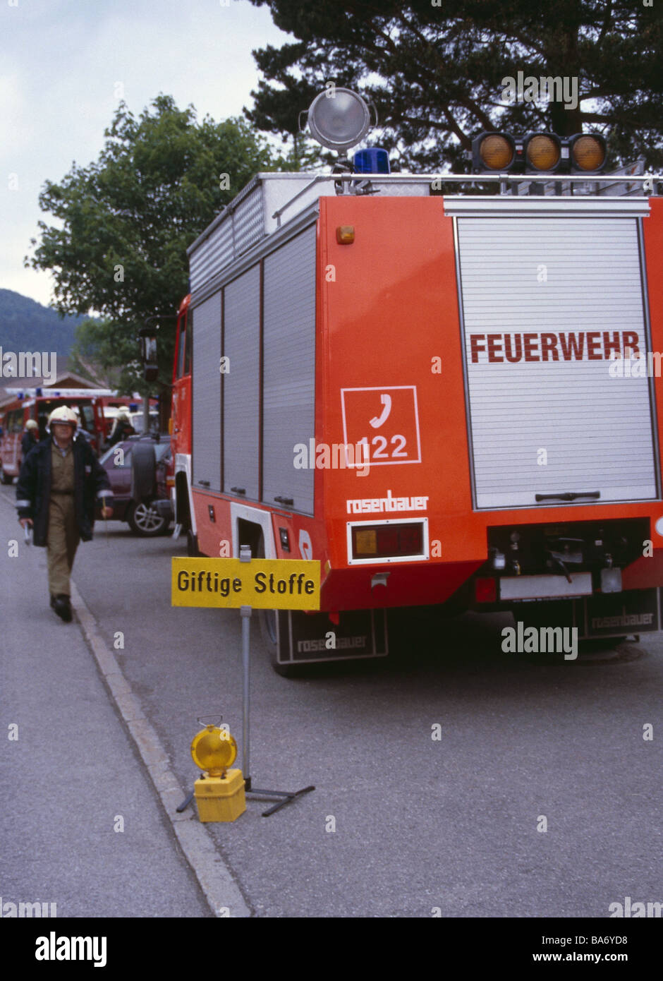 Roadside fire engine warning-sign "poisonous materials" firefighter no ...