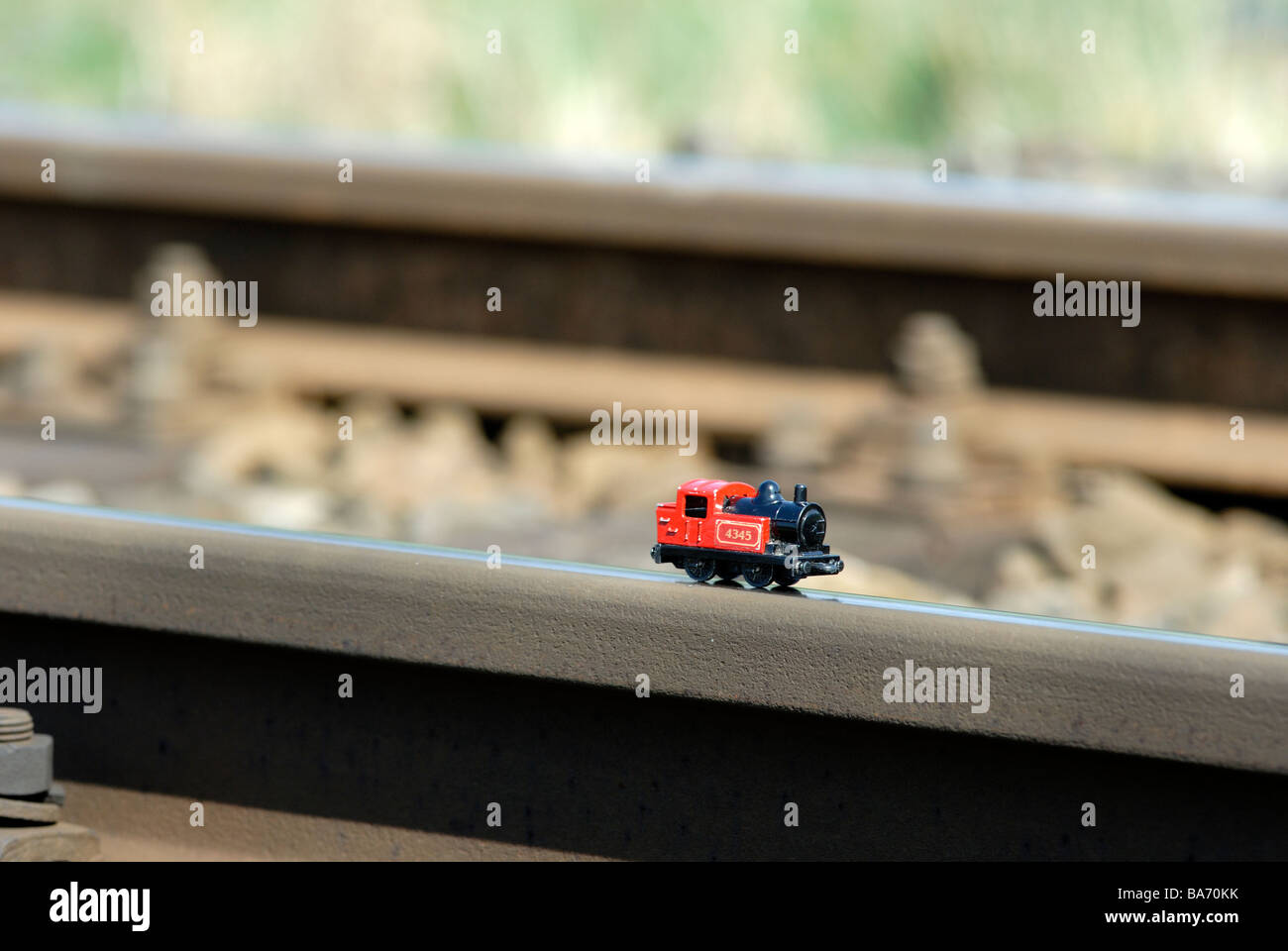 Steam locomotive engine, train model railway on real track outside ...