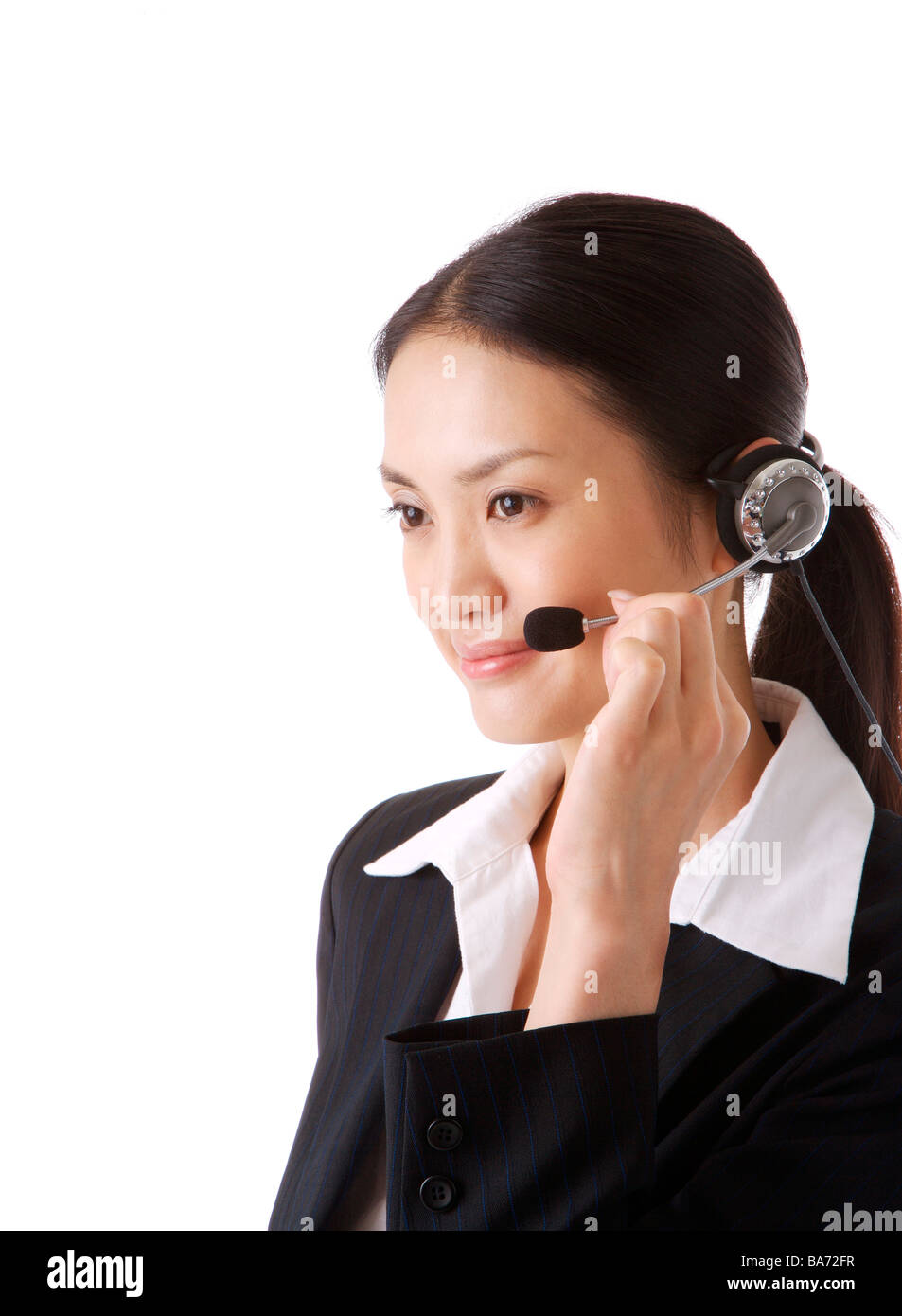 Businesswoman wearing headset side view Stock Photo - Alamy