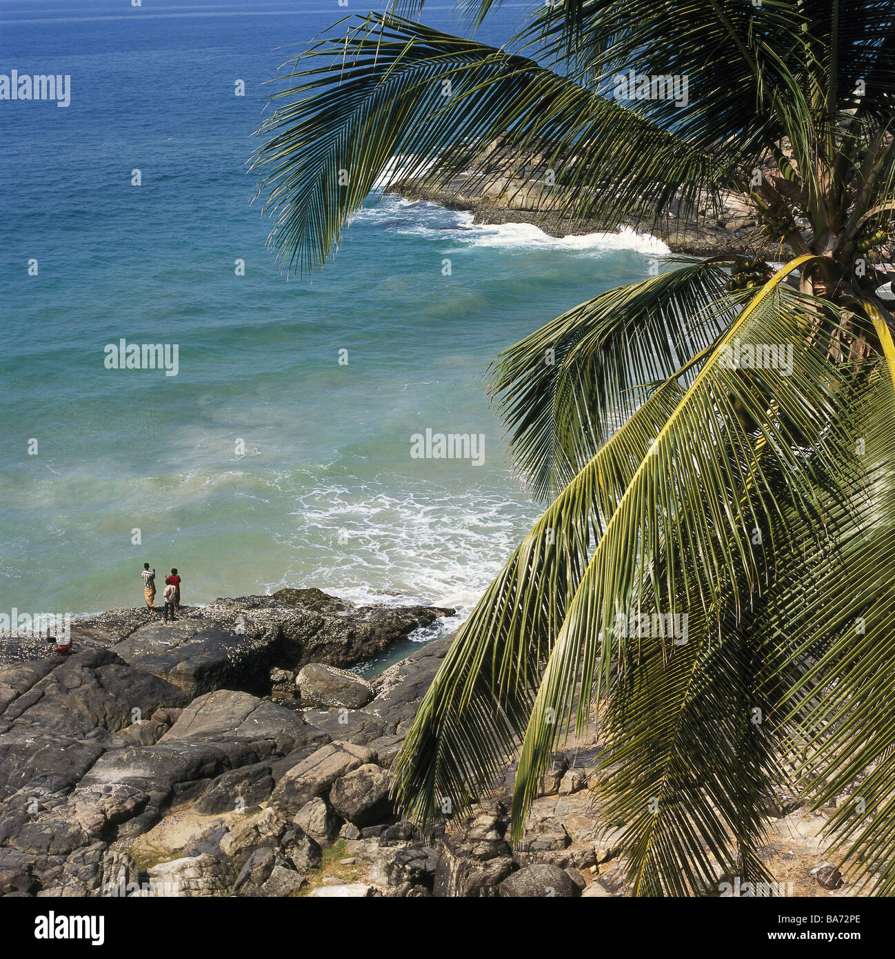 India Kerala Kovalam rock-coast men rock stands back-opinion from above ...