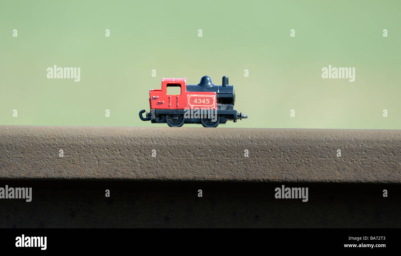 Steam locomotive engine, train model railway on real track outside ...