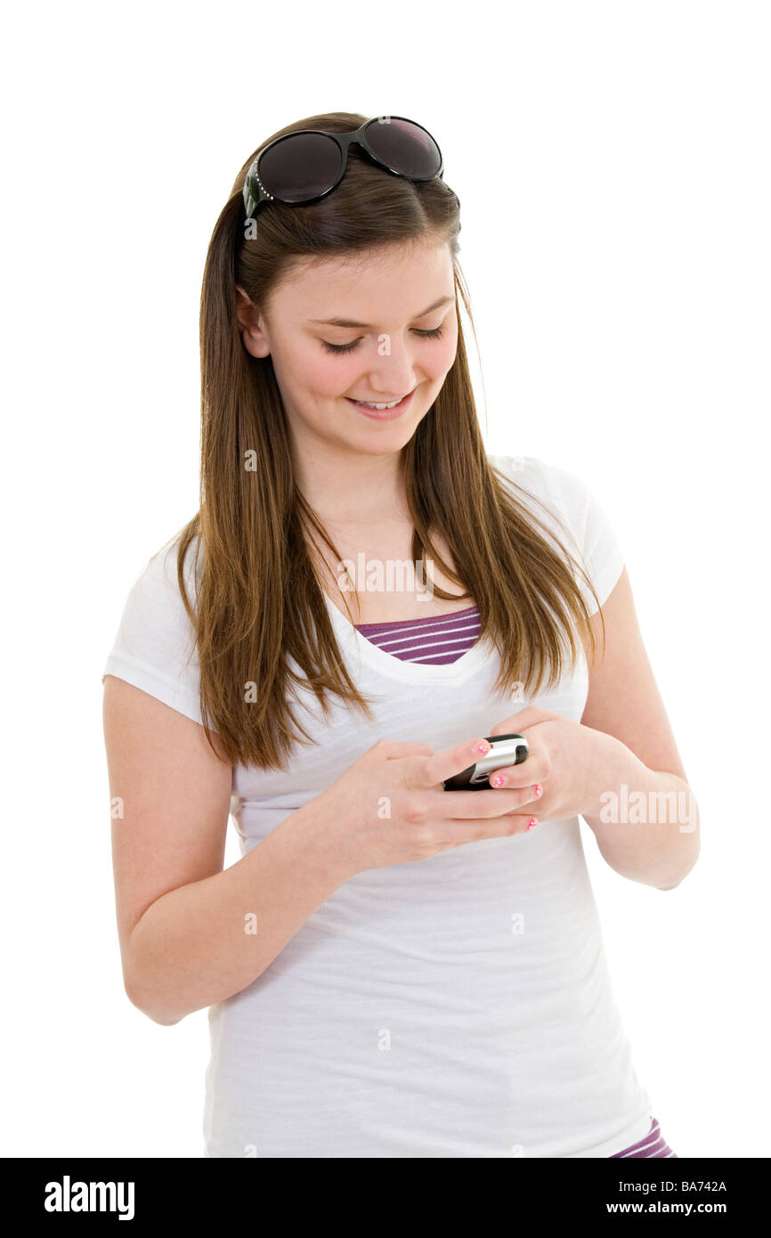 Caucasian teenager text messaging on white background Stock Photo - Alamy
