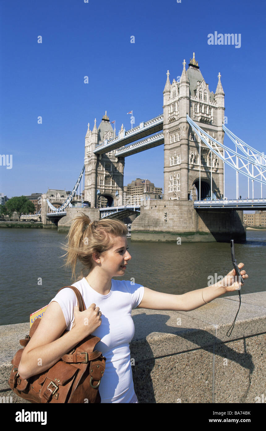 Great Britain England London tower bridge woman young photo-cell phone ...