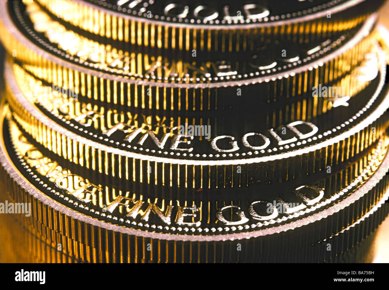 A stack of fine pure precious metal gold coins Stock Photo - Alamy