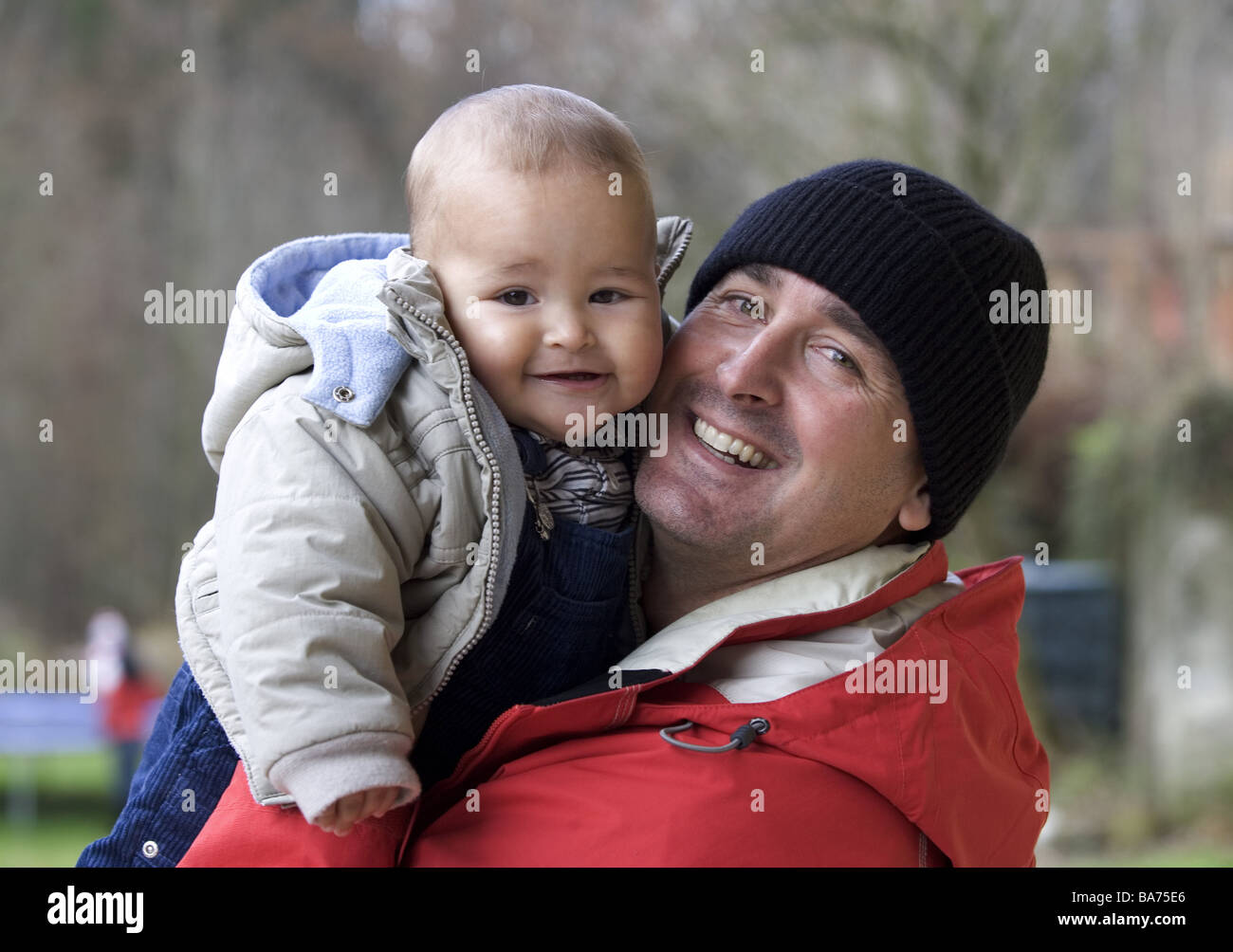 Father baby happily holds portrait people man parent paternity jacket ...