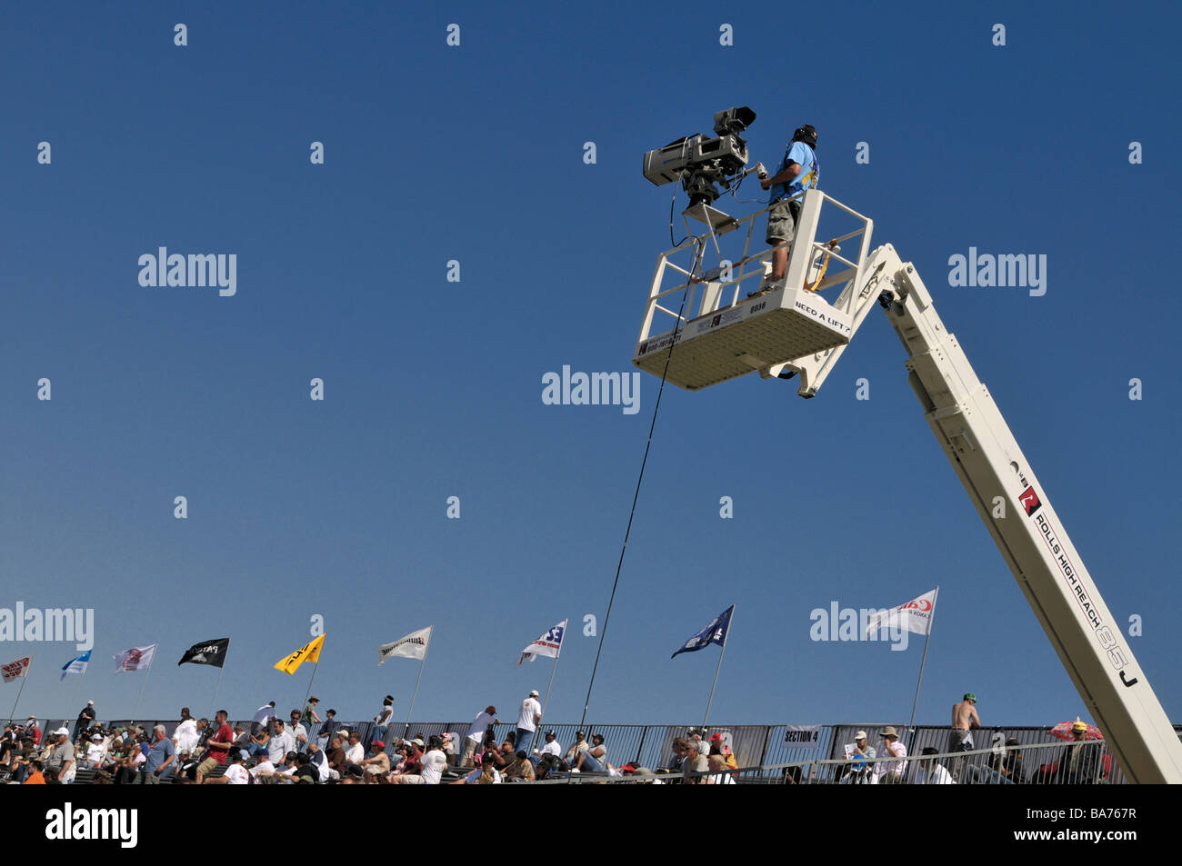 Elevated television camera man Stock Photo - Alamy