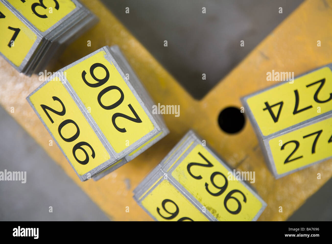Logistics-center camp-license plates stack detail from above economy ...