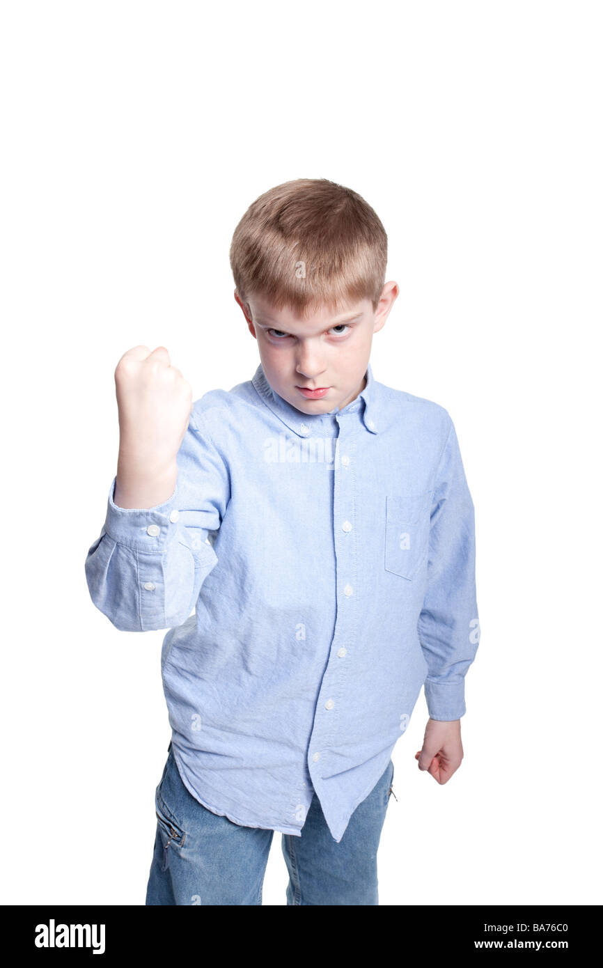 Young boy shaking his fist in anger Stock Photo - Alamy