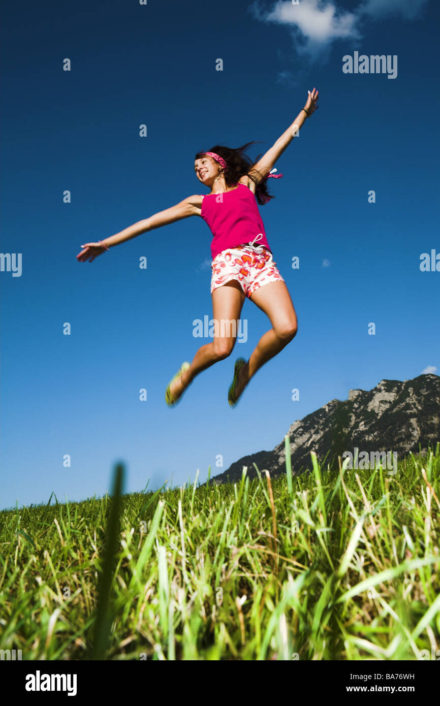 Teenagers girls air-jump cheerfully from below series people 19 years ...