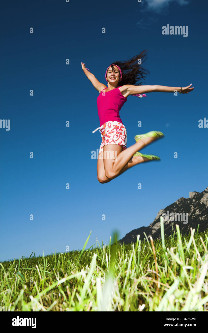 Teenagers girls air-jump cheerfully from below series people 19 years ...