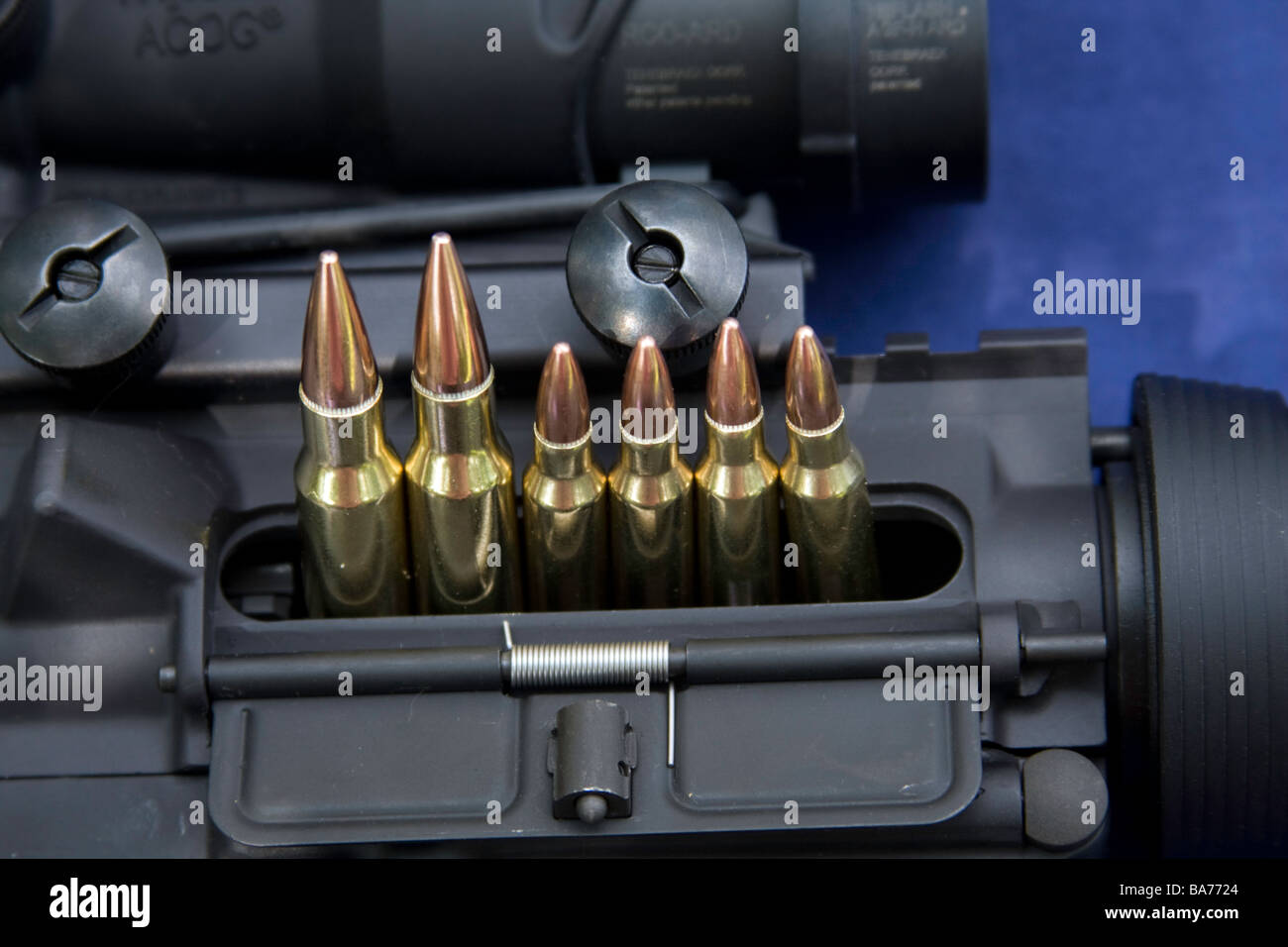 Bullets and ammunition stand ready to be loaded in an automatic rifle ...