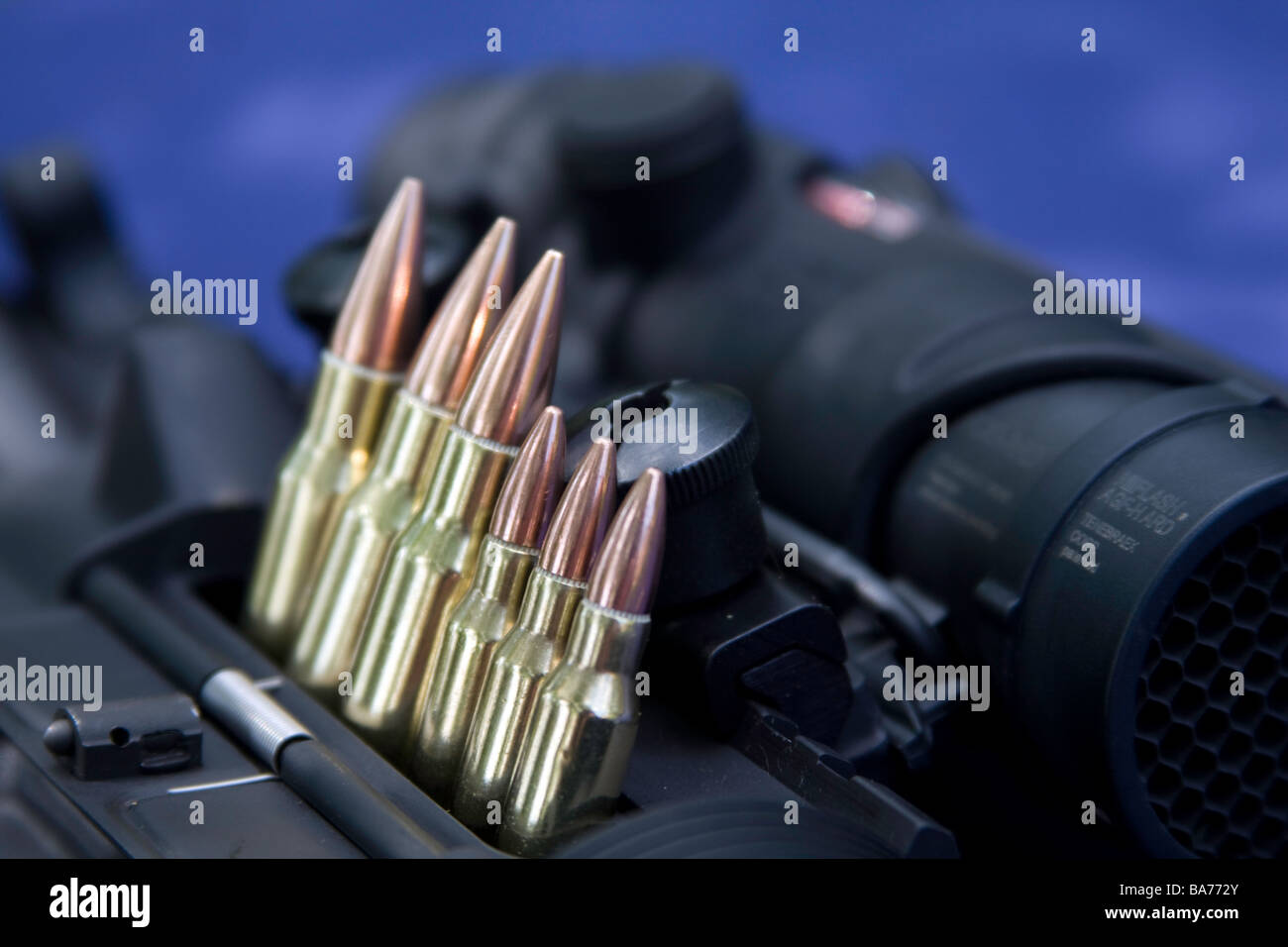 Different bullets stand ready in the chamber of an automatic rifle ...