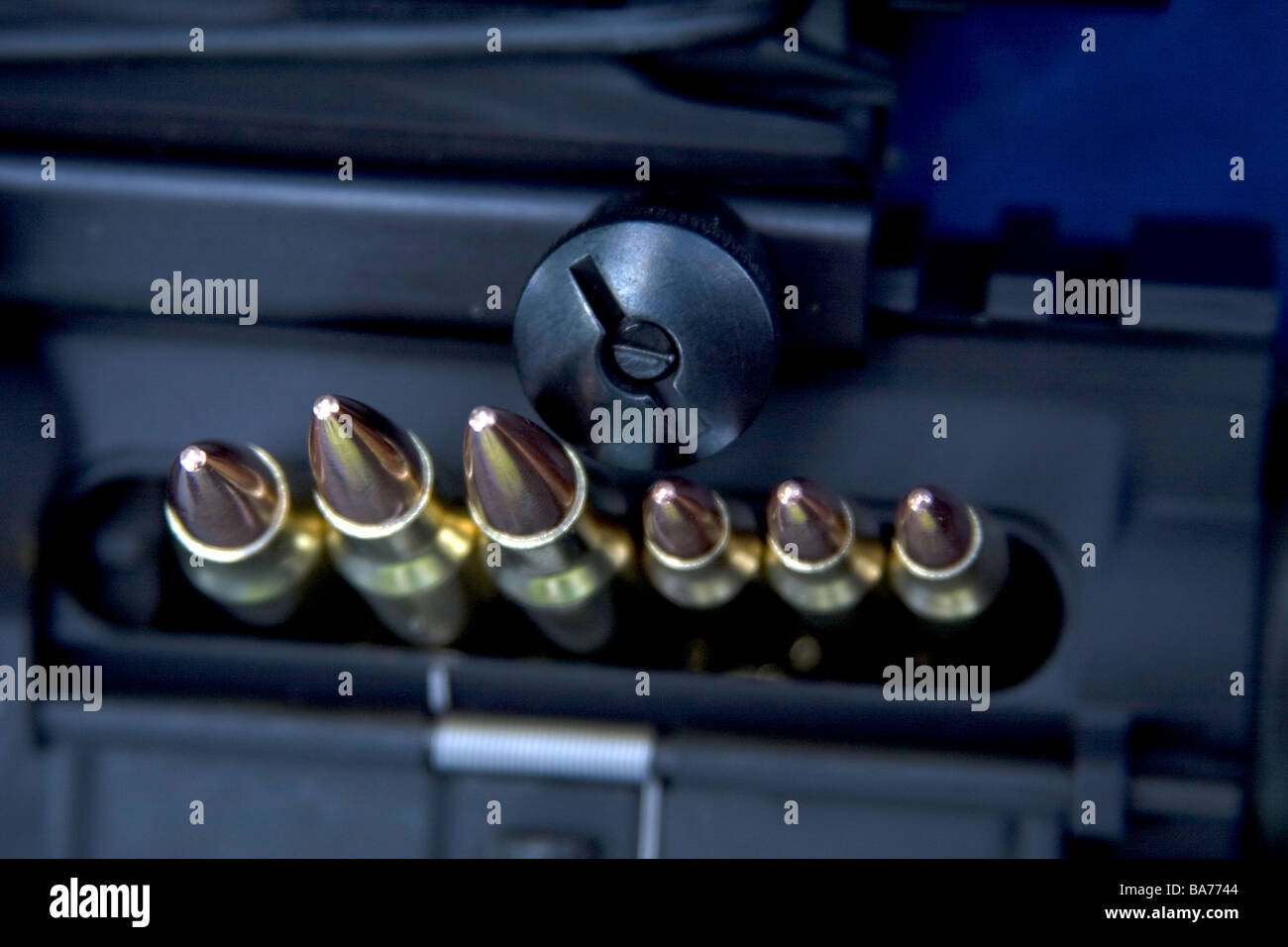 Different bullets stand ready in the chamber of an automatic rifle ...