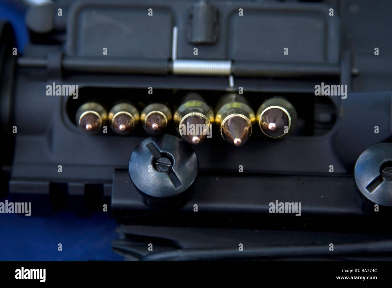 Different bullets stand ready in the chamber of an automatic rifle ...