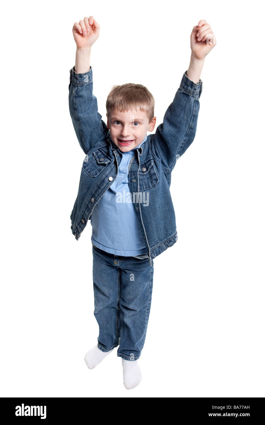 Young boy cheering with arms raised - isolated on white background ...