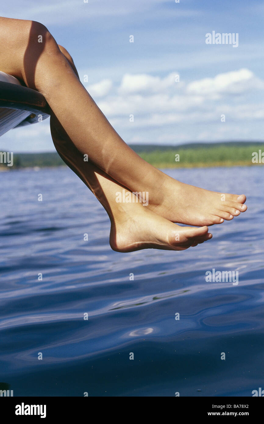 Boat woman bow sits detail legs barefoot sea boat-tour boat-trip people ...