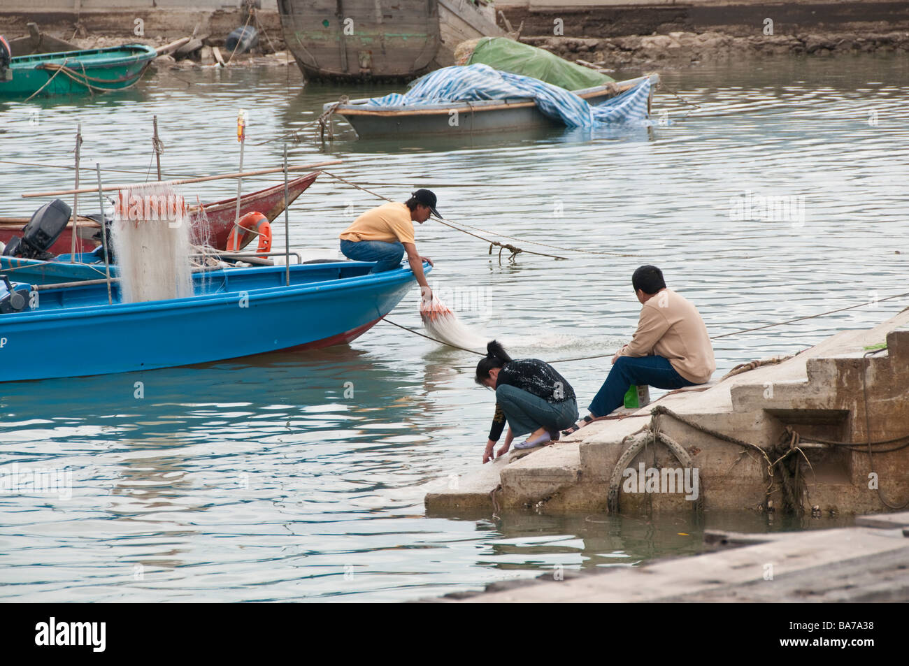 Washing fishing nets hi-res stock photography and images - Alamy
