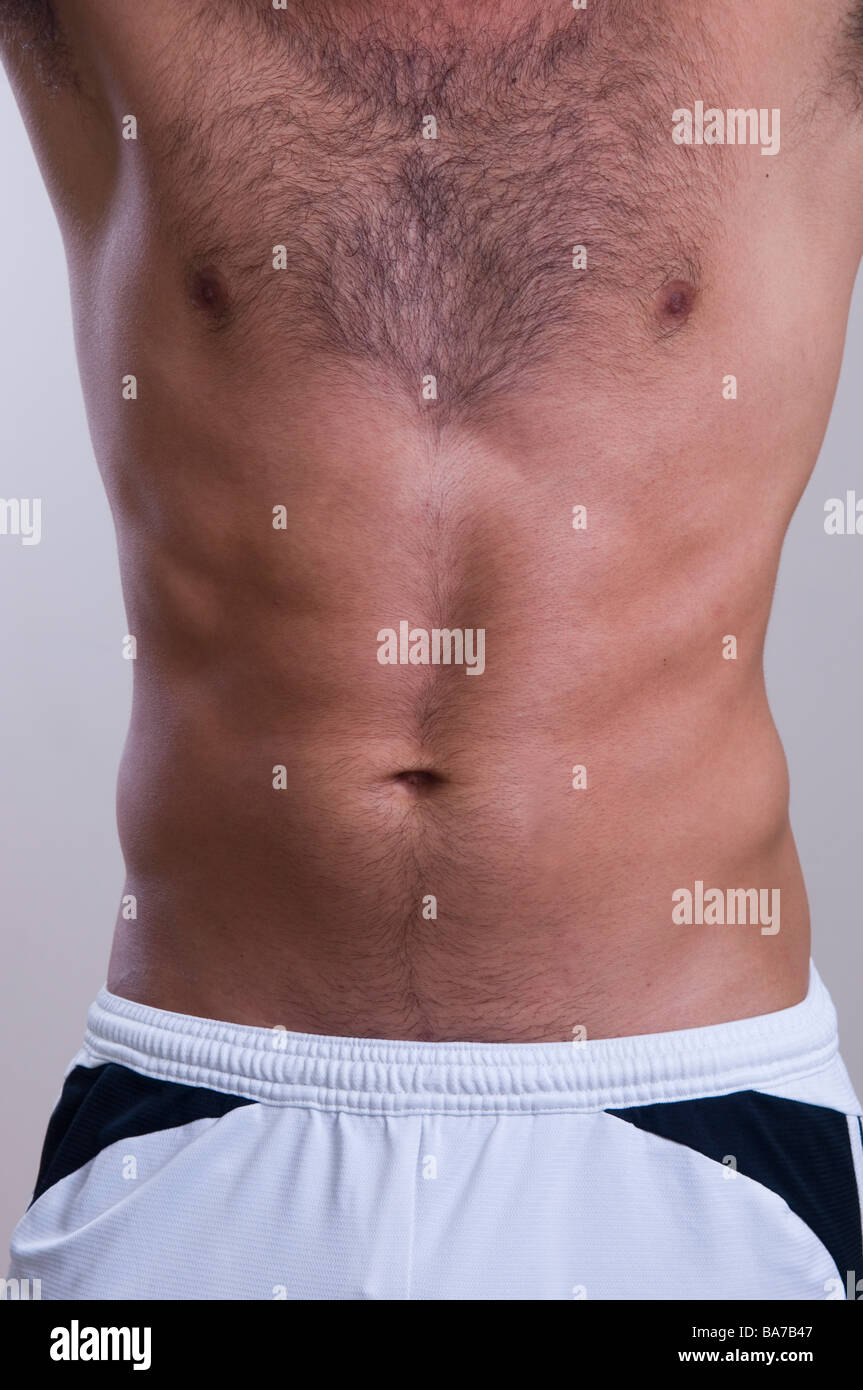 Close up of a young man with toned abs Stock Photo - Alamy