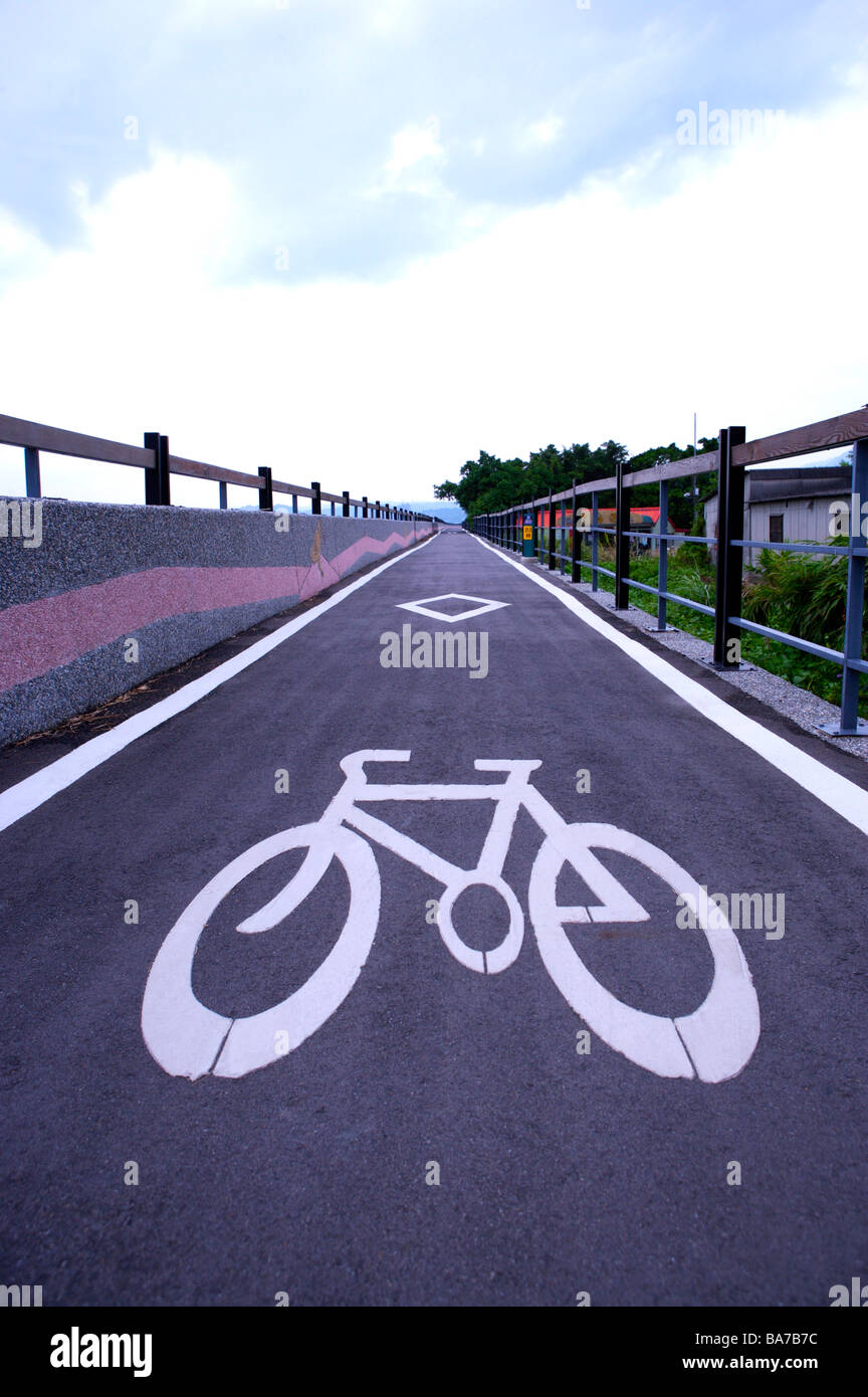 Bicycle sign on road Stock Photo - Alamy