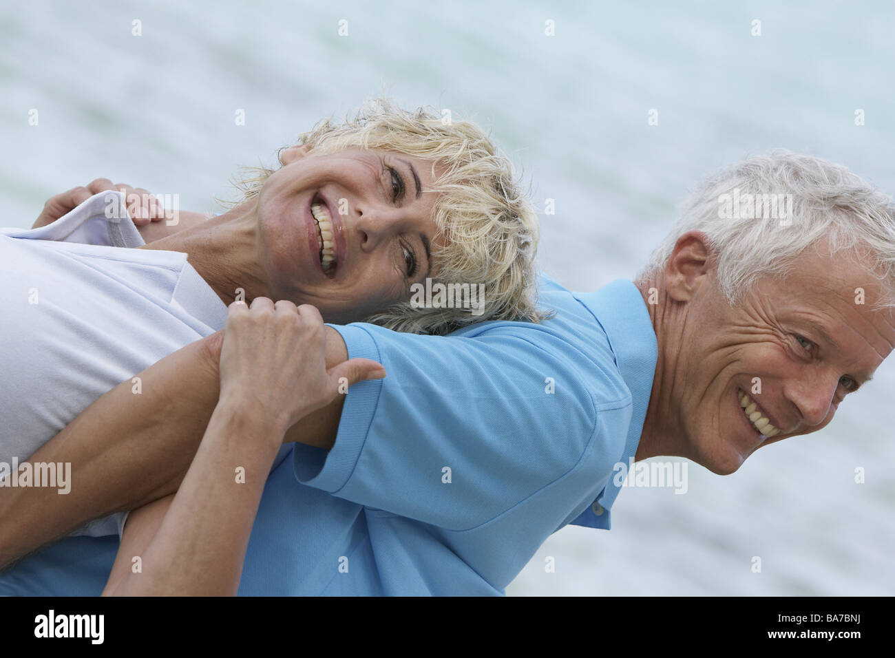 Sandy beach senior-pair omitted cheerfully detail series people 50-60 ...
