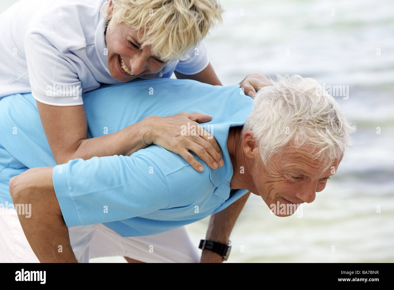 Sandy beach senior-pair omitted cheerfully detail series people 50-60 ...