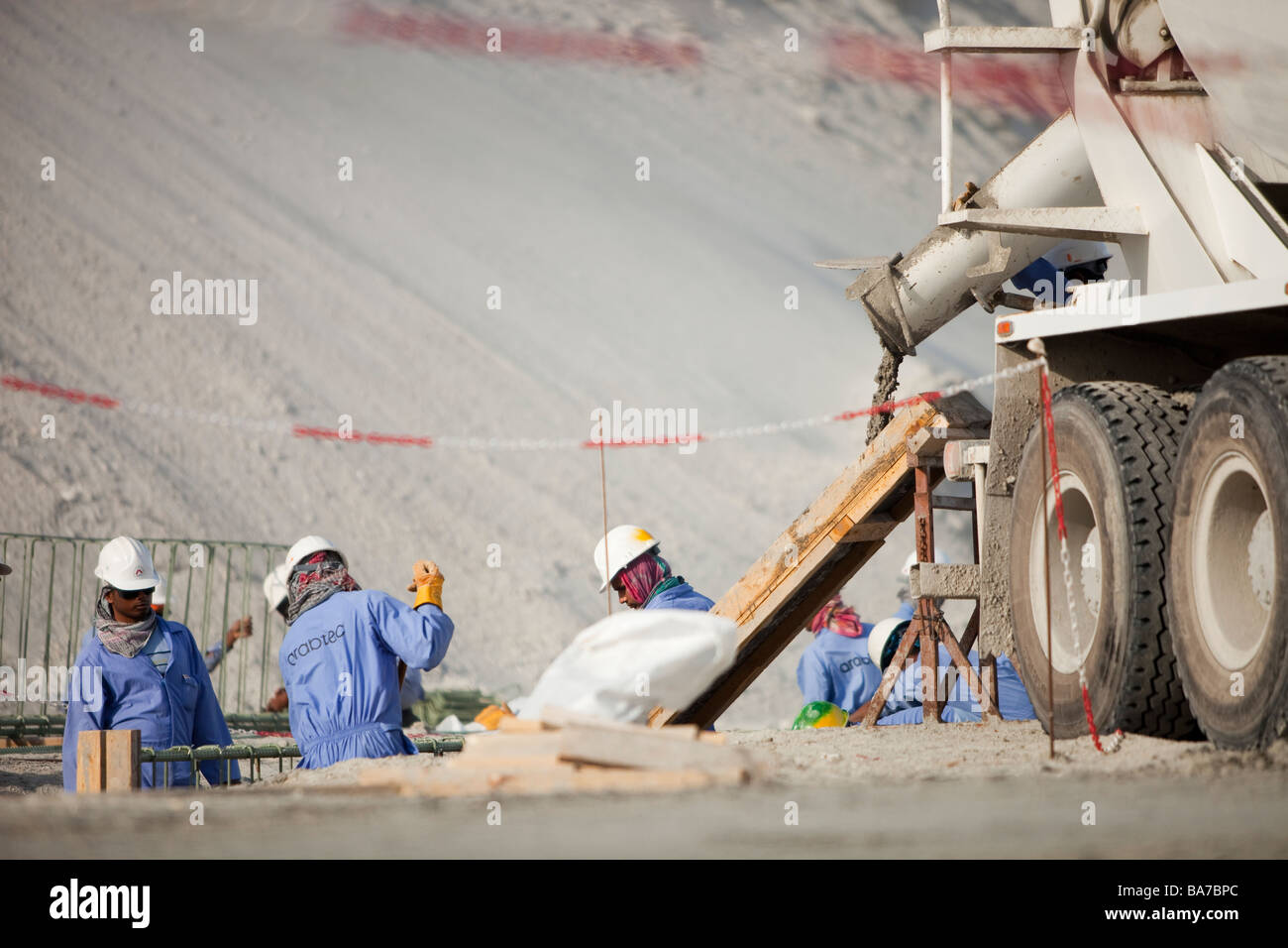 Arab workers working on a reclamation scheme to build another exclusive ...