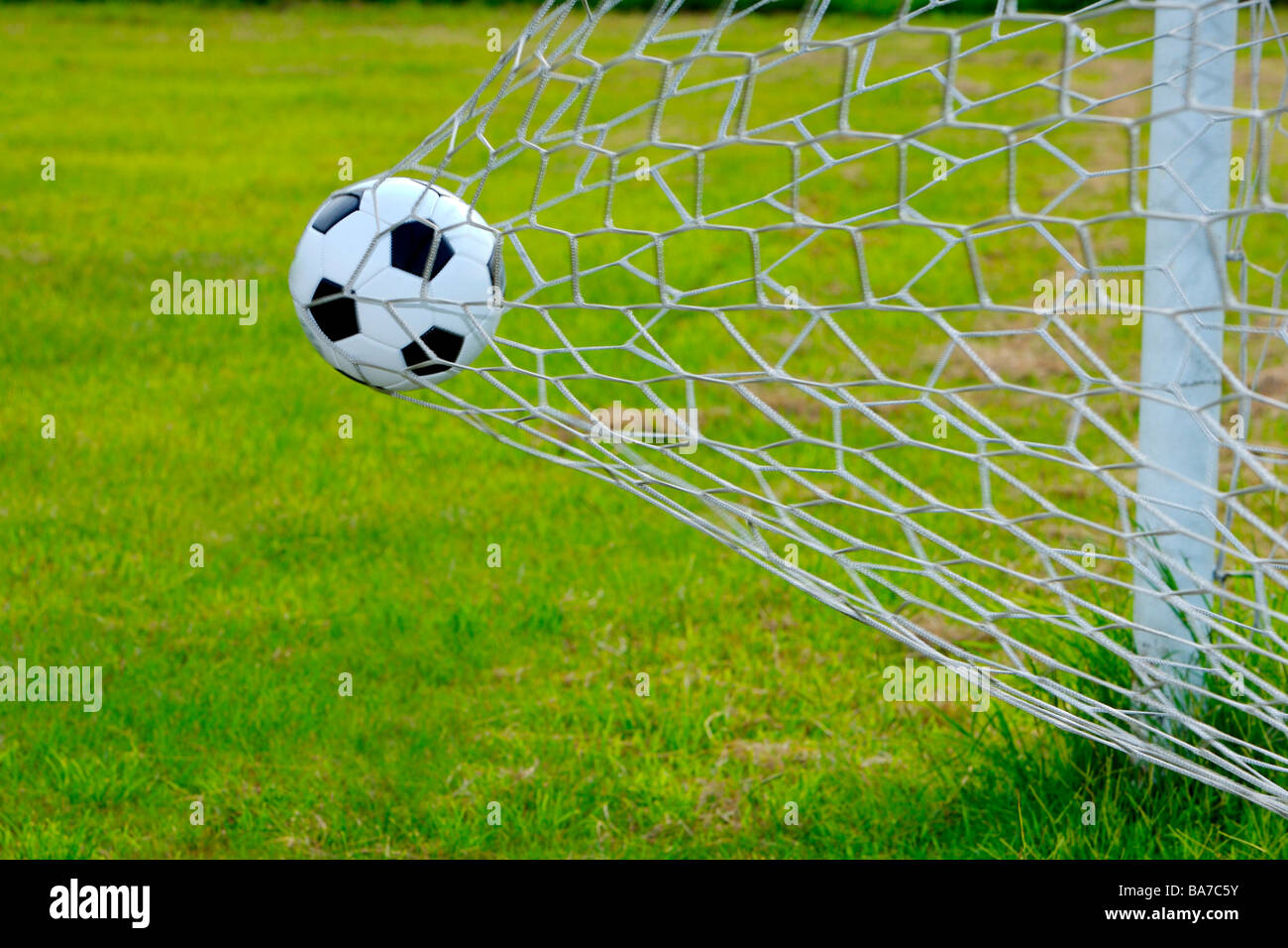 Soccer ball in net hi-res stock photography and images - Alamy