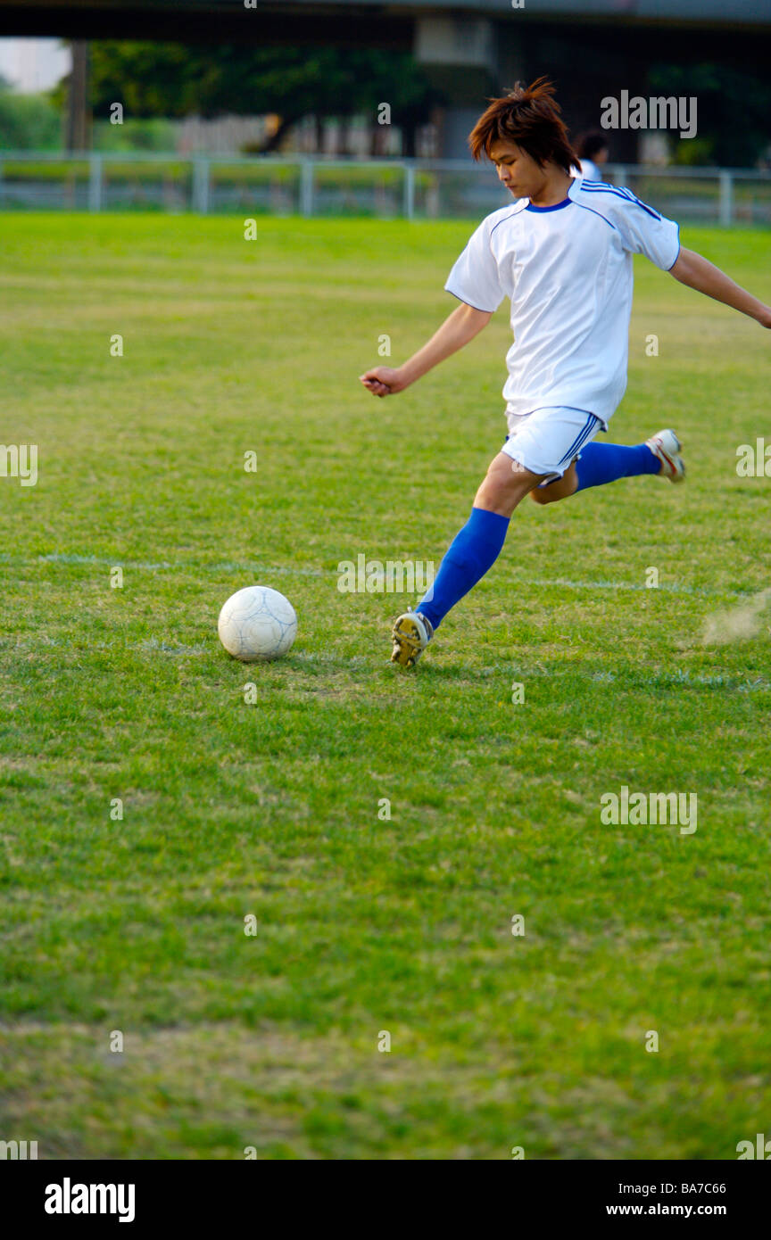 One young man playing soccer ball Stock Photo - Alamy