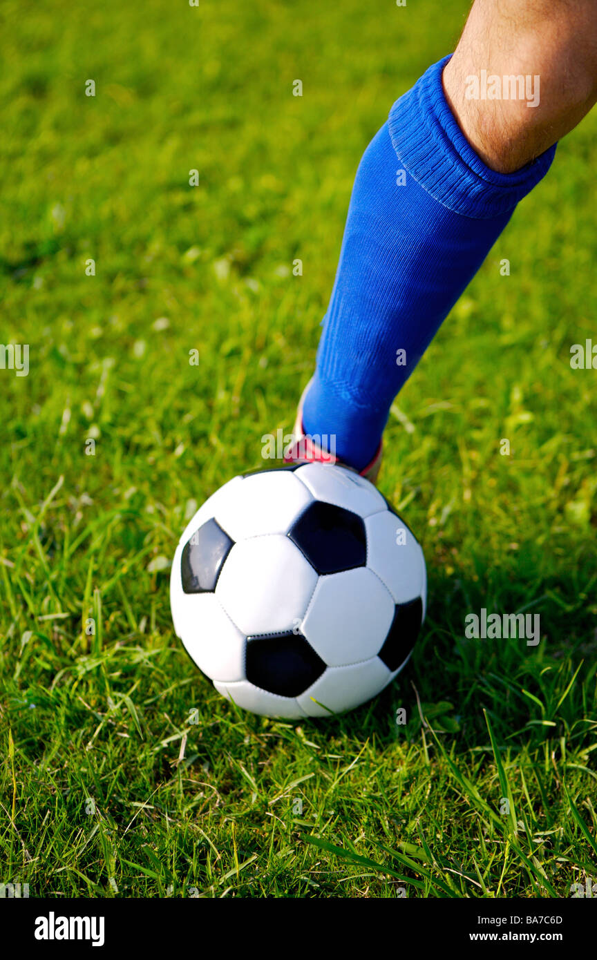 Soccer ball on player s foot focus on foot Stock Photo - Alamy