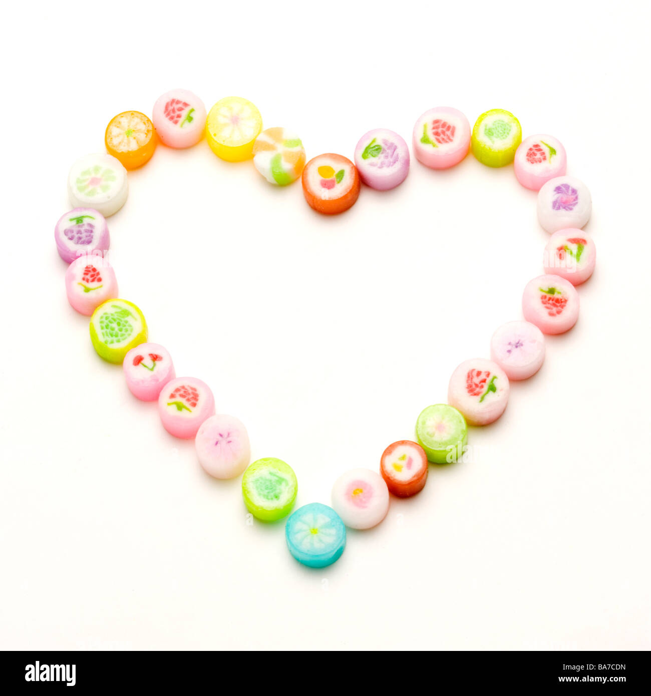 Heart shaped small candies hi-res stock photography and images - Alamy