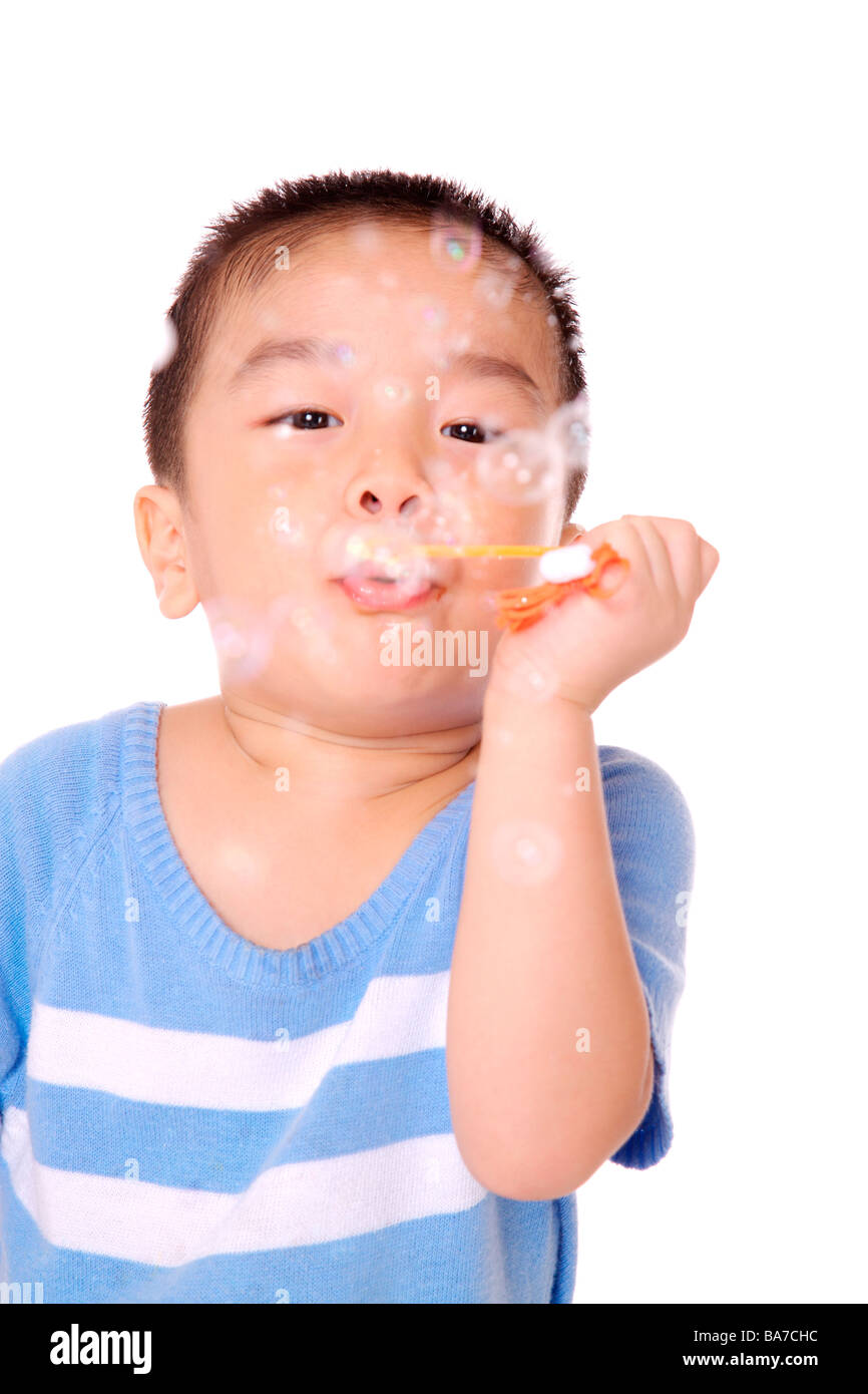Boy blowing bubble portrait Stock Photo - Alamy