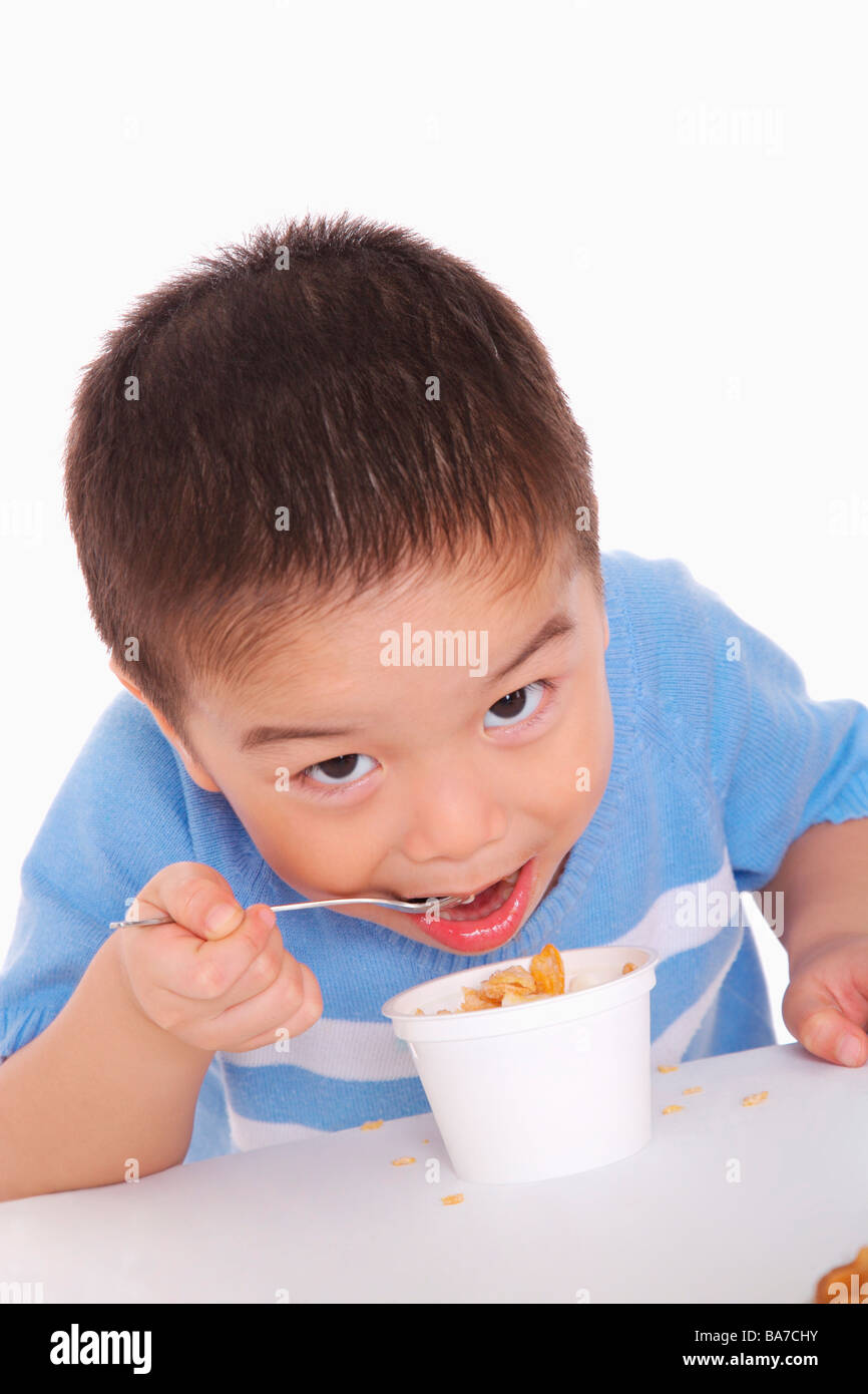 Boy eating food portrait Stock Photo - Alamy